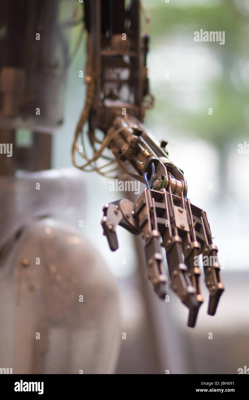 Future technology in black prosthetic hand with a blurred backgound ...