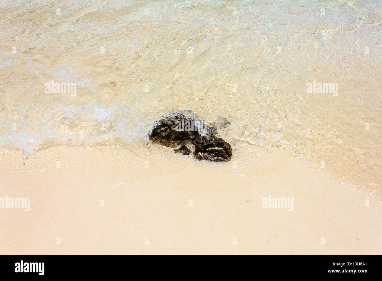Blue water texture with small stones Stock Photo - Alamy