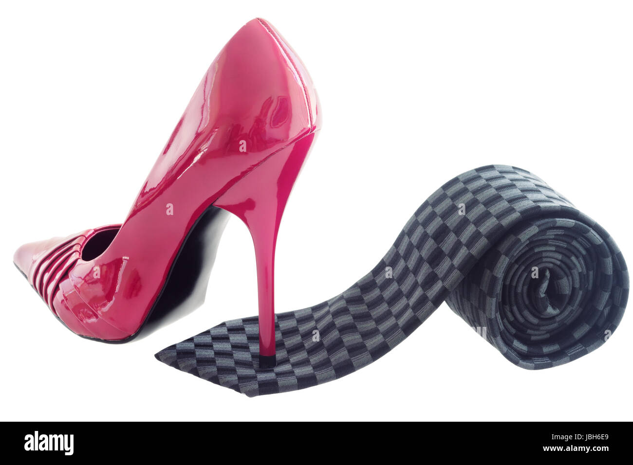 Red lady shoe on a dark necktie, concept of woman dominating over a man ...