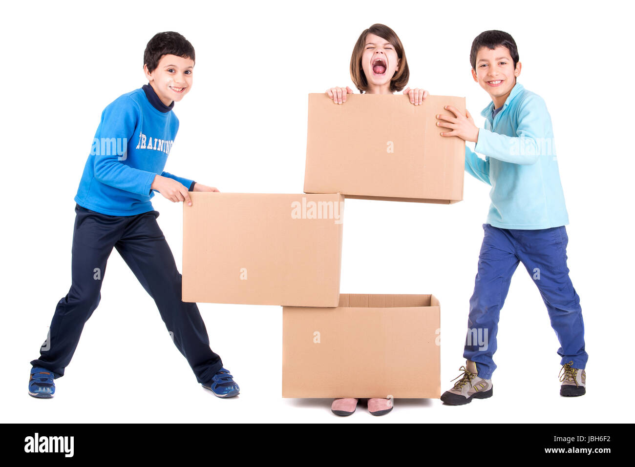 Kids playing with cardboard boxes Stock Photo - Alamy