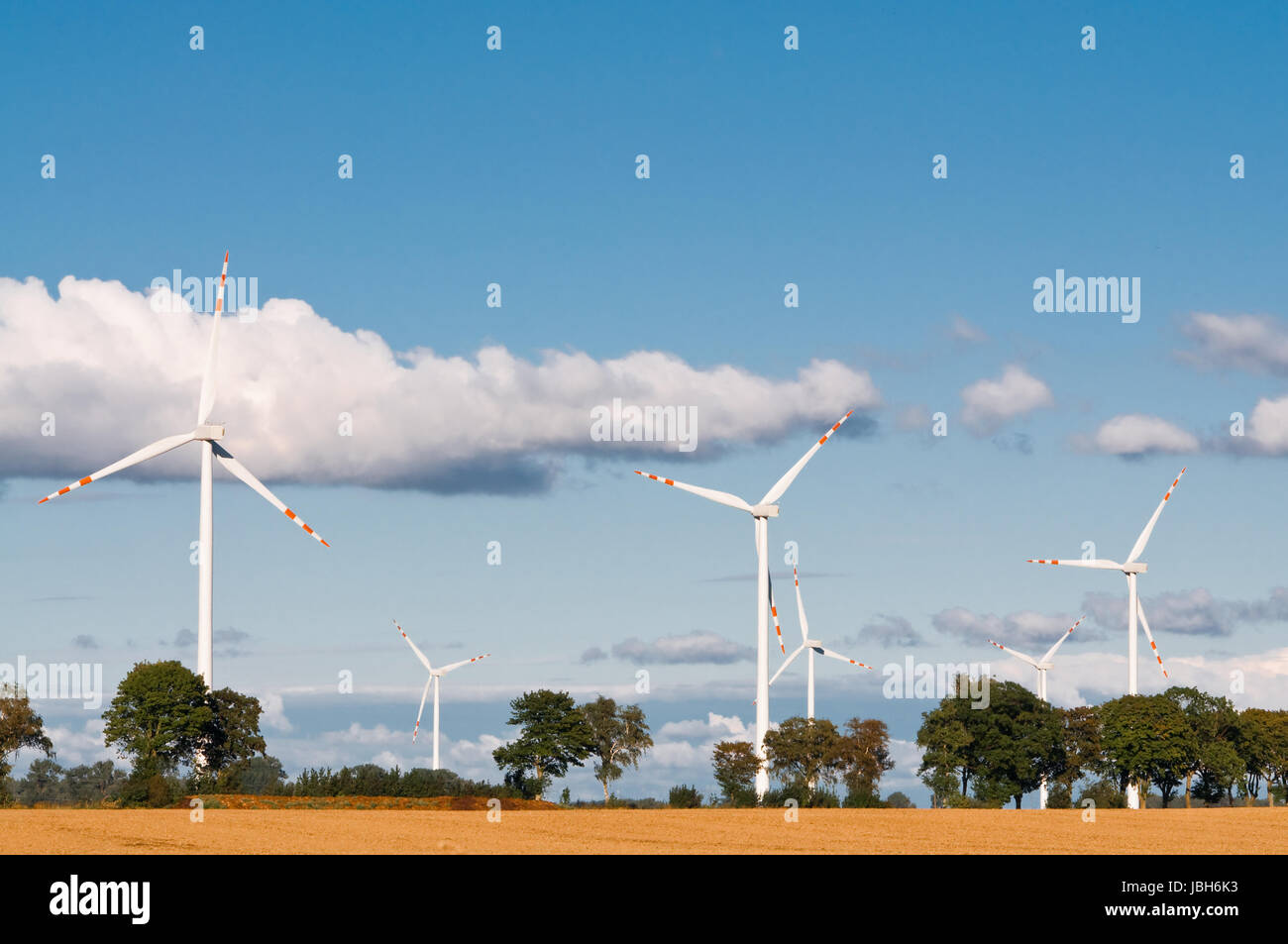 Wind turbine farm on rural terrain Stock Photo - Alamy