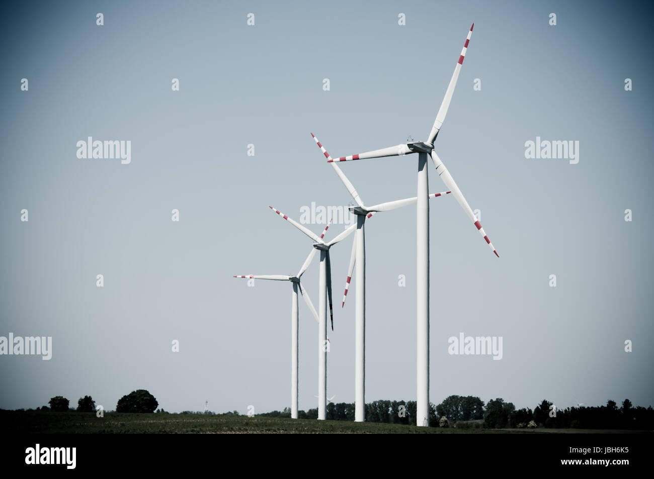 Wind turbine farm on rural terrain Stock Photo - Alamy