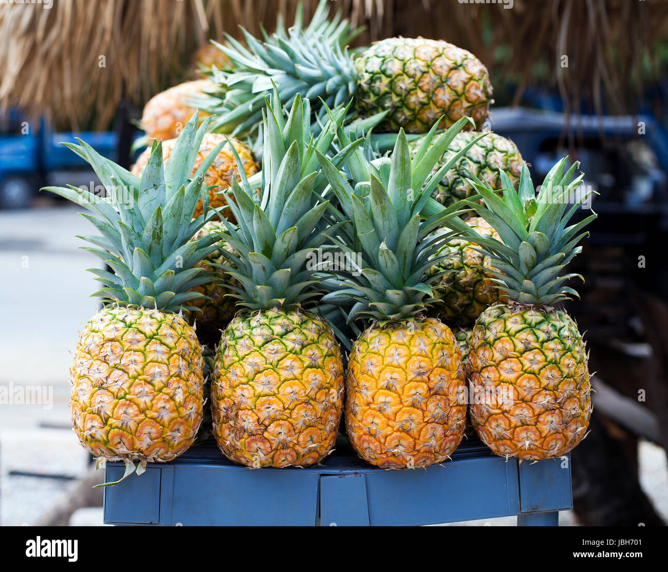 Pile of pineapples at street market, closeup Stock Photo - Alamy