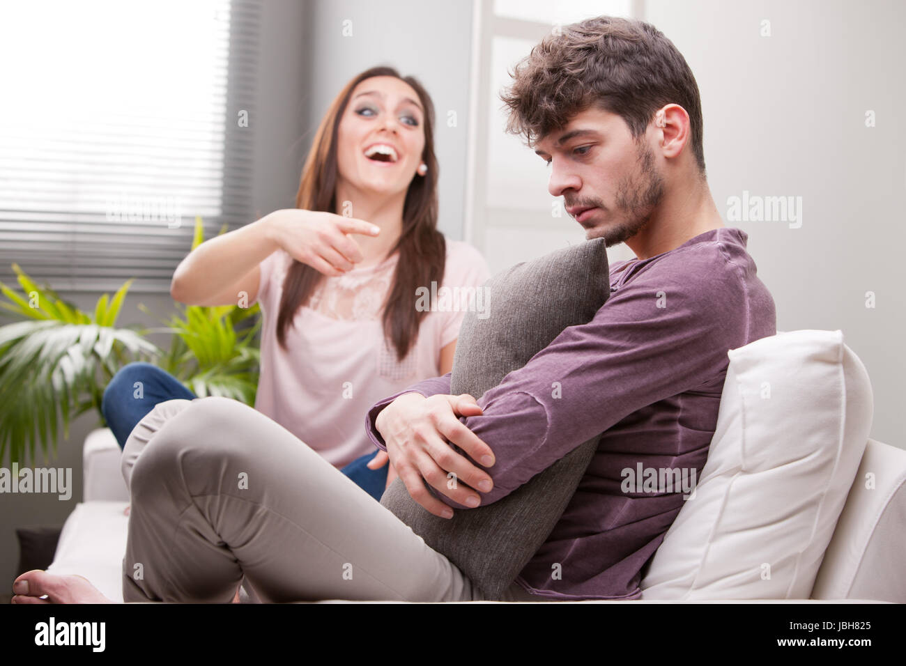 frustrated and very sad man laughed by his woman Stock Photo - Alamy
