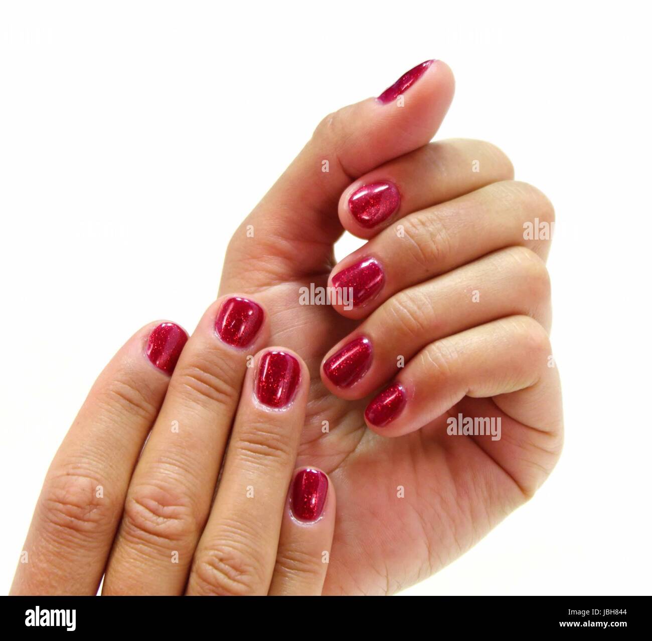 two women hands with red nails on a white background Stock Photo - Alamy