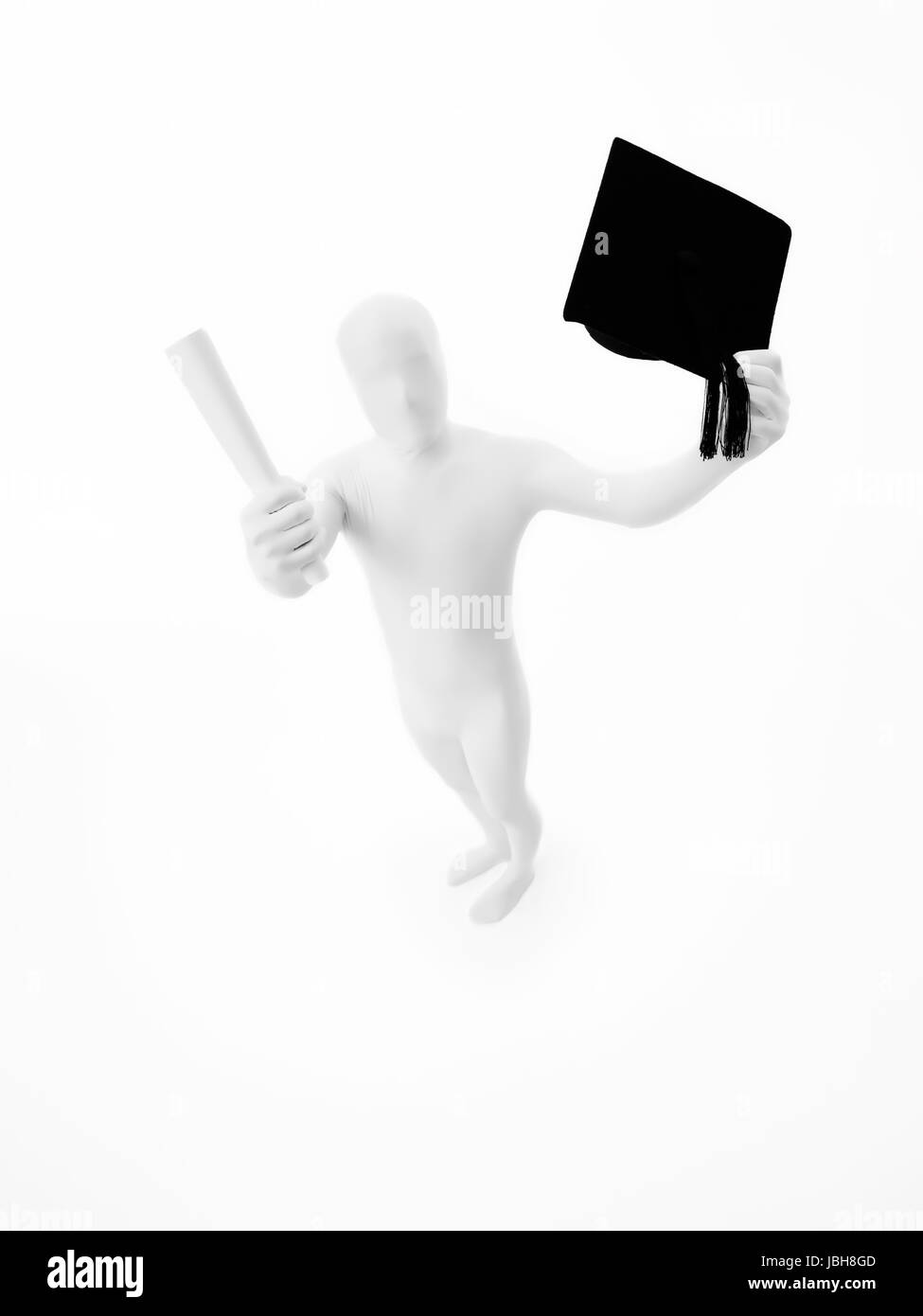 Unknown person dressed in black tie and white suit holding graduation ...