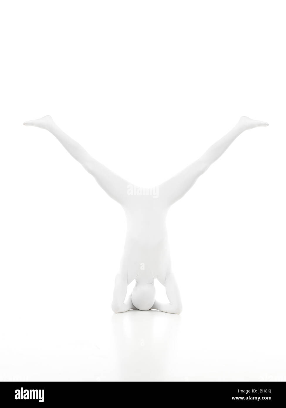 unknown faceless man sitting in yoga position on white background ...