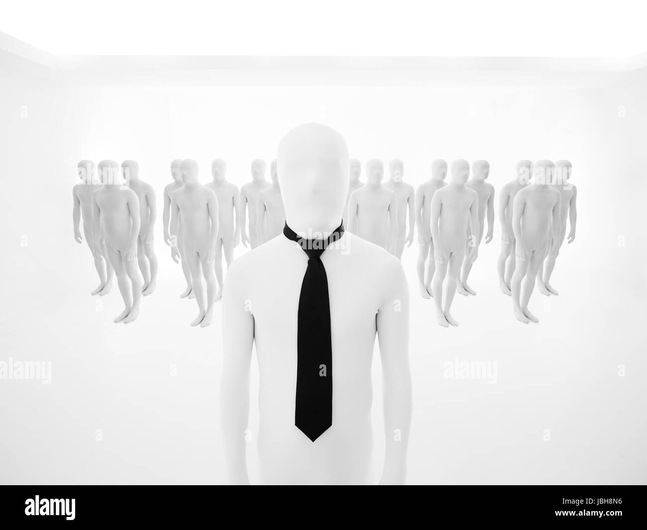 leading man dressed in white with black tie and background of aligned ...