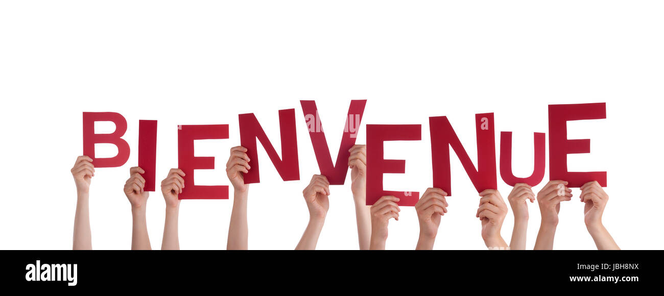 Many People Holding the French Word Bienvenue which means Welcome ...