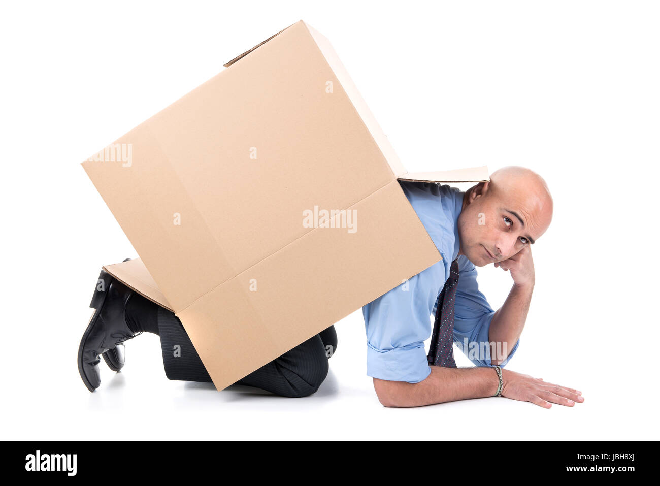 Businessman inside a cardboard box Stock Photo - Alamy
