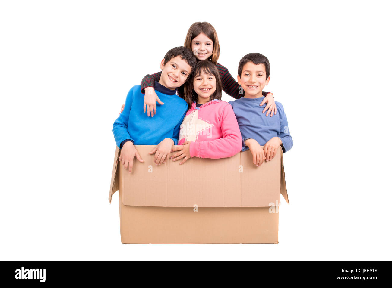 Happy kids inside a cardboard box isolated in white Stock Photo - Alamy