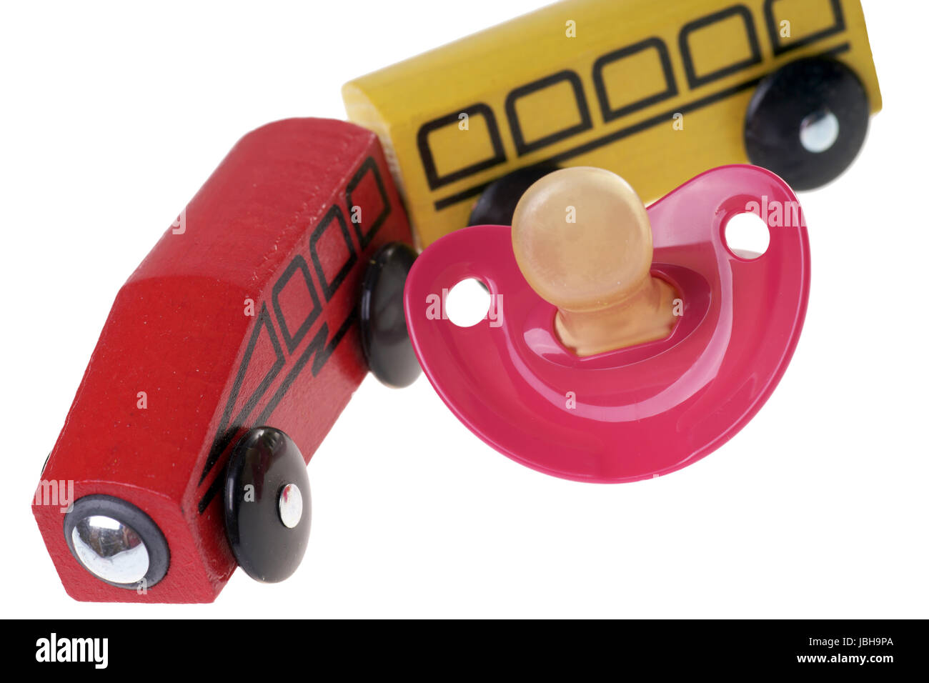 wooden toy with pacifier over a white background Stock Photo - Alamy