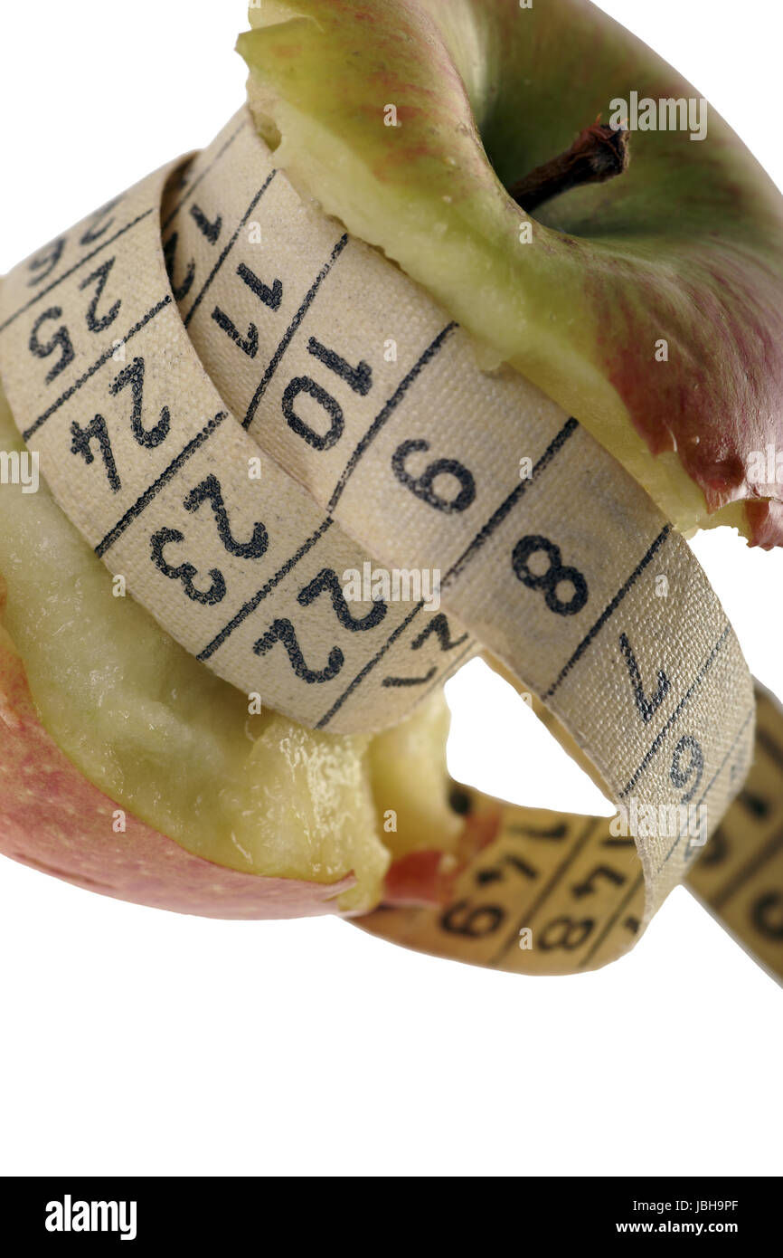 Apple with measure tape over a white background Stock Photo - Alamy