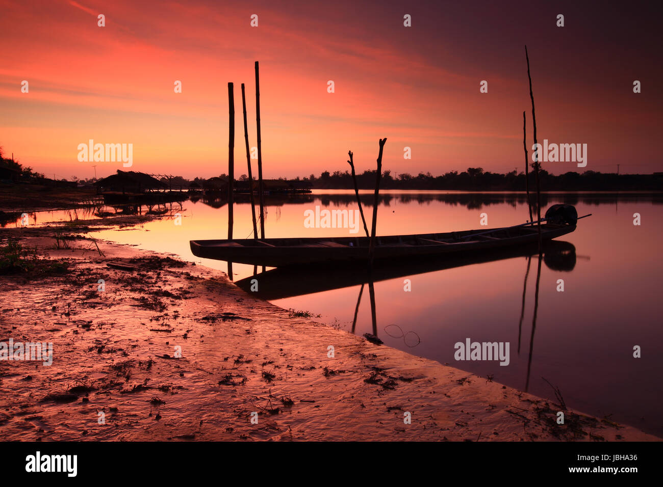 Fishing boat on the “Moon River” in Thailand after sunset Stock Photo ...