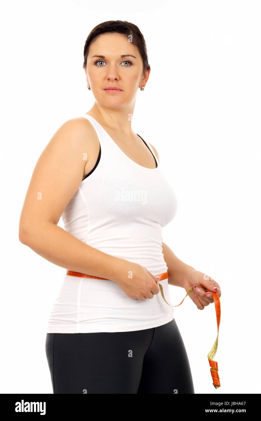Woman measuring her waist Stock Photo - Alamy