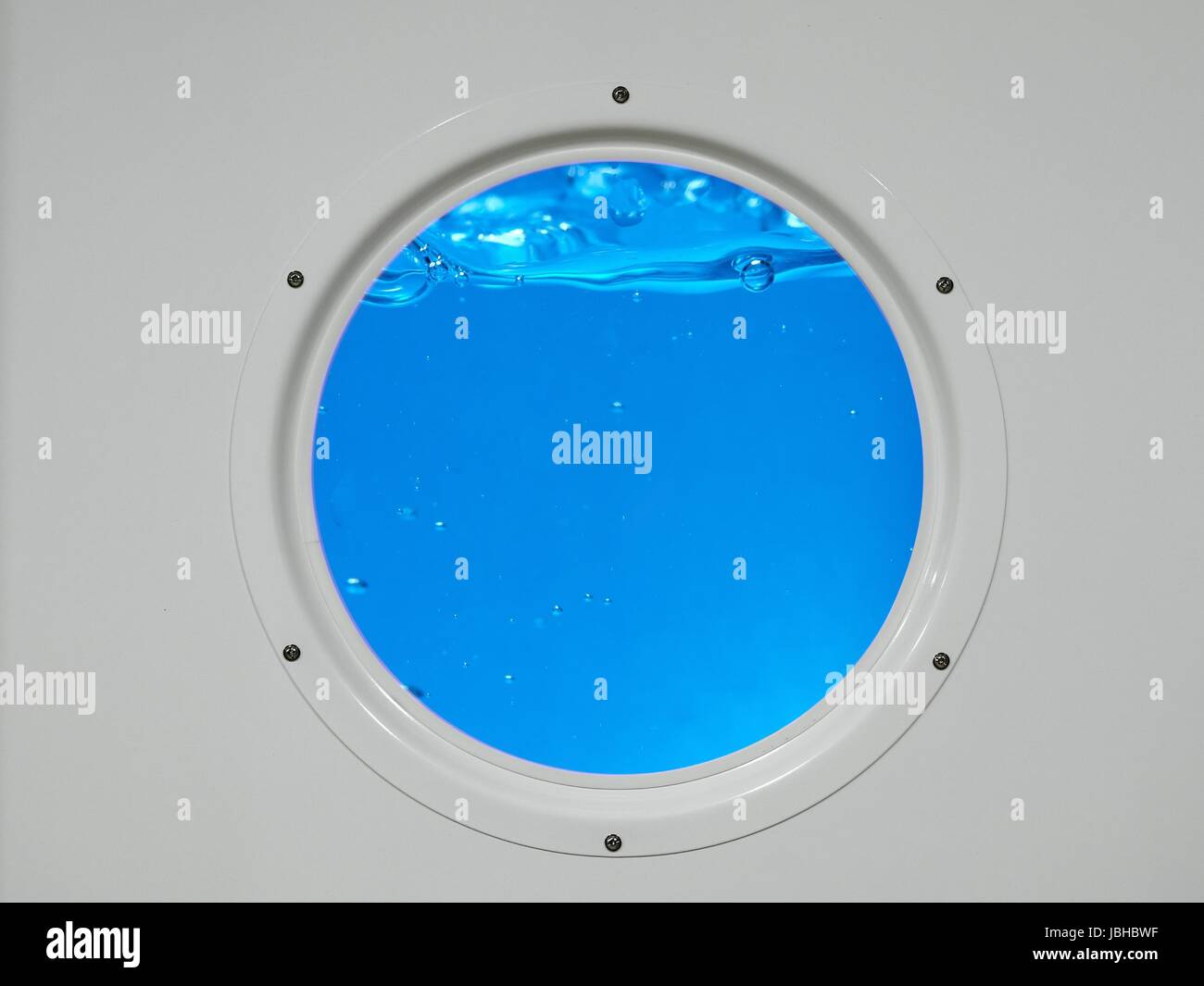 Metal porthole with water behind Stock Photo - Alamy