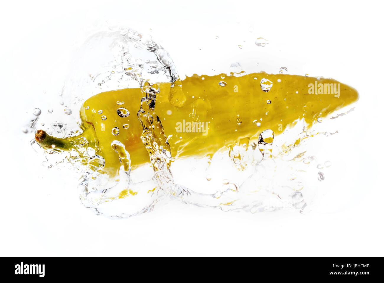 yellow pepper with water splash isolated on white Stock Photo - Alamy