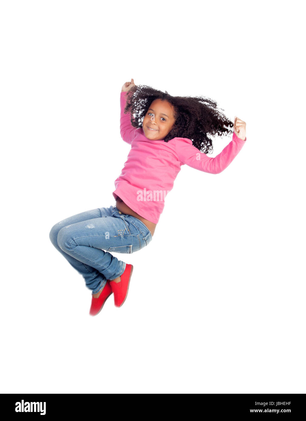 Funny girl jumping isolated on a white background Stock Photo - Alamy