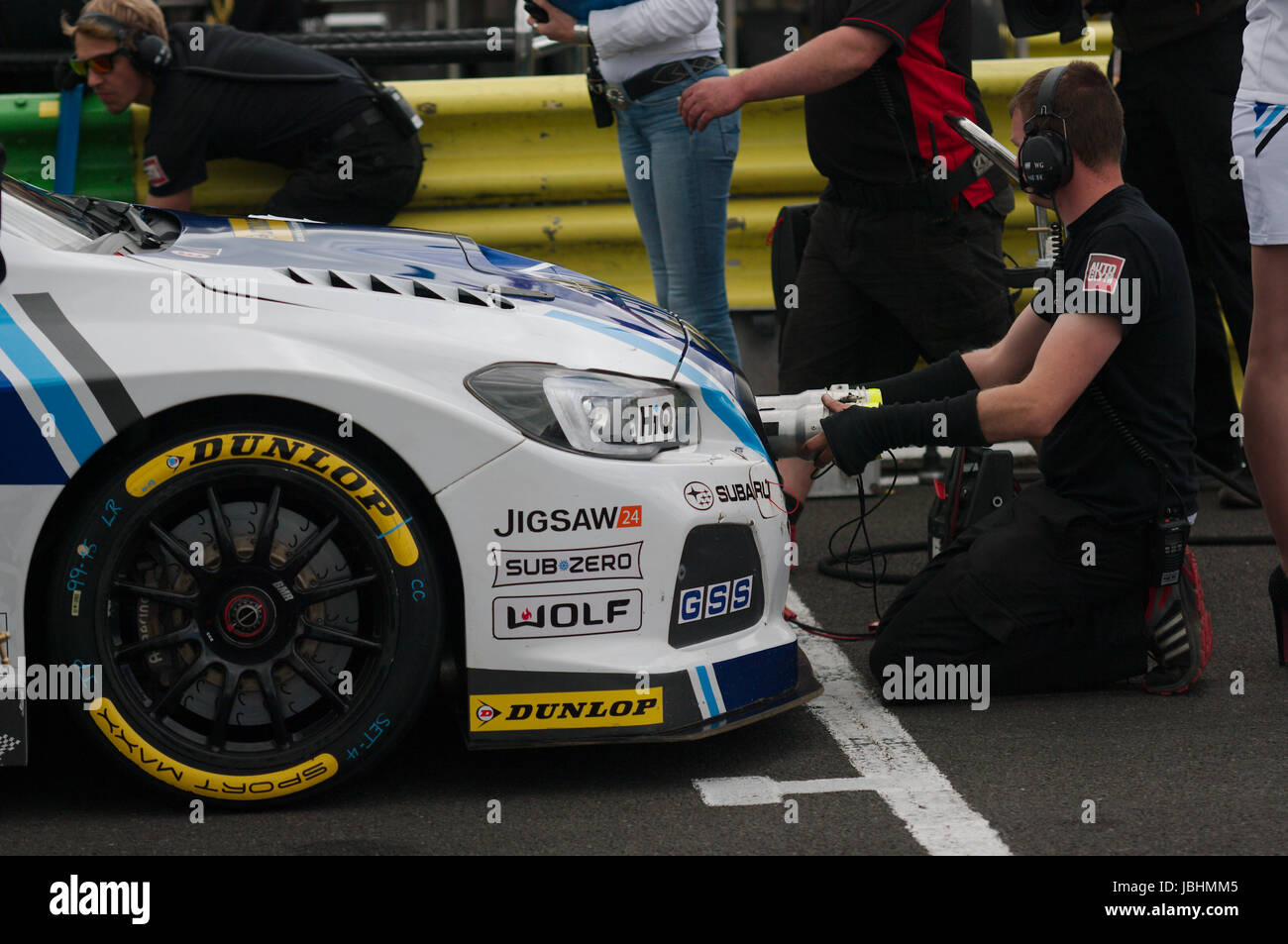 Croft Circuit, England, 11th June 2017. Mechanics working on the car of ...