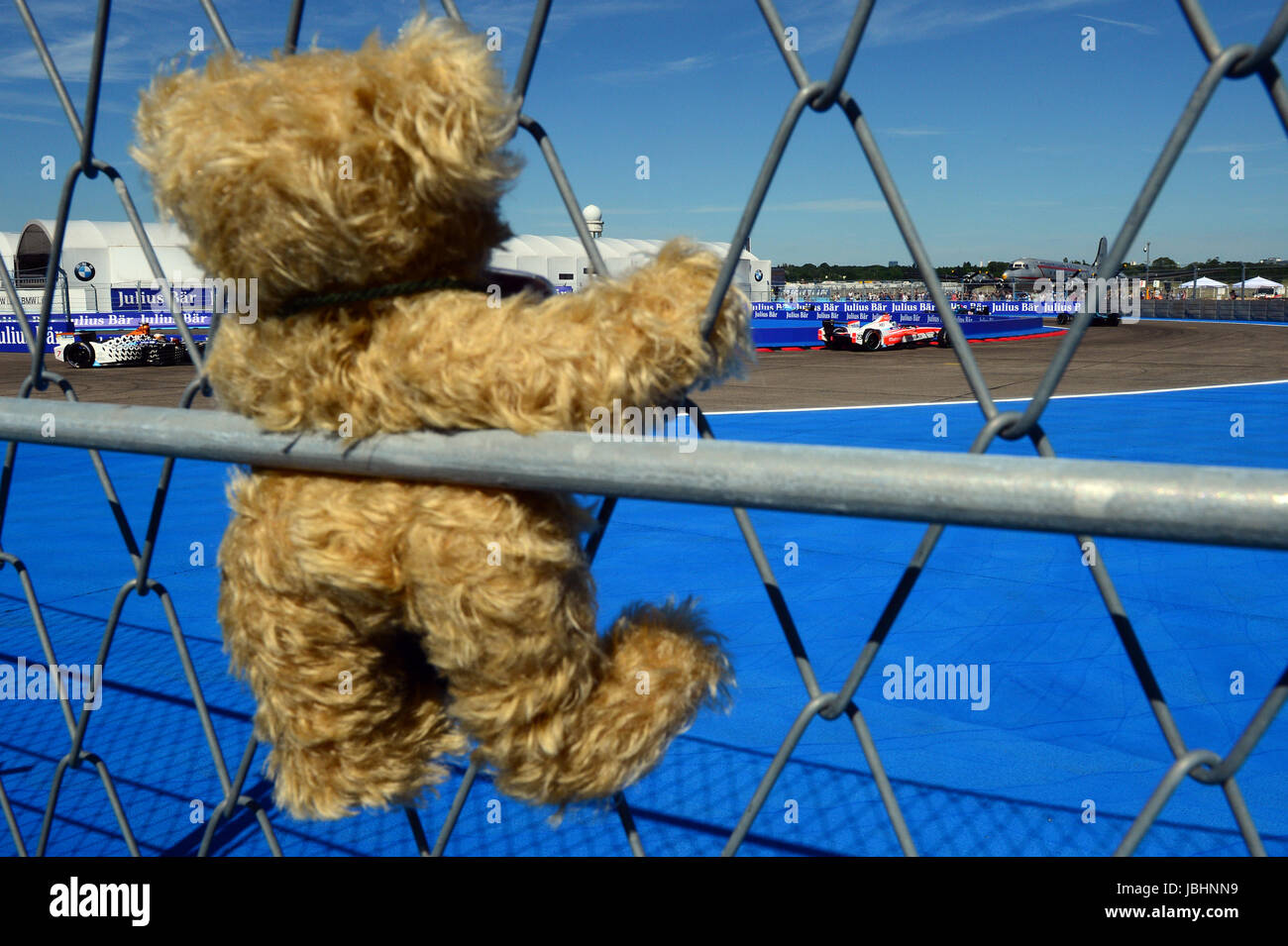 A teddy bear wedged in the safety fence at the first corner at the ...