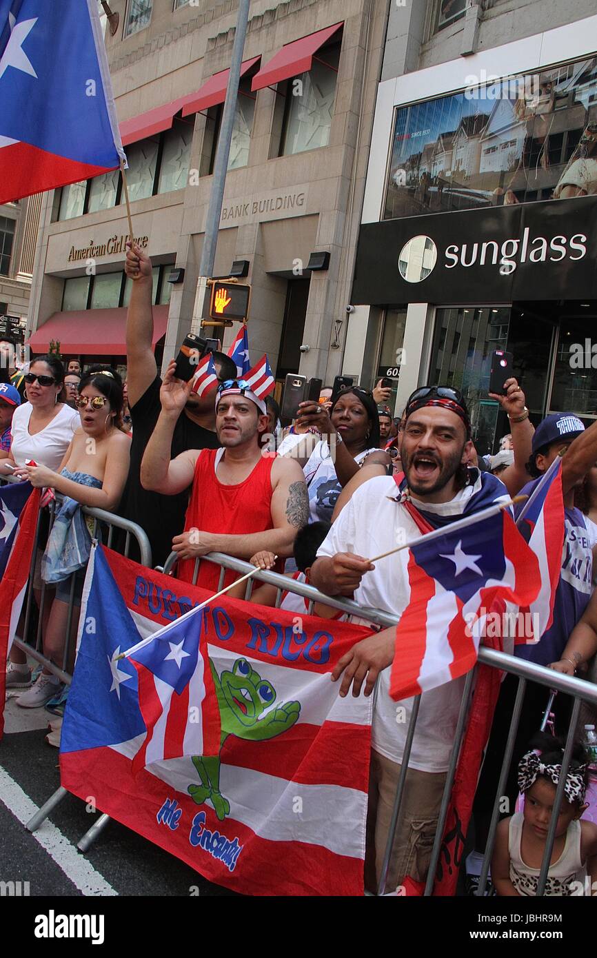 New York, NY, USA. 11th June, 2017. Parade onlookers cheer Oscar Lopez ...