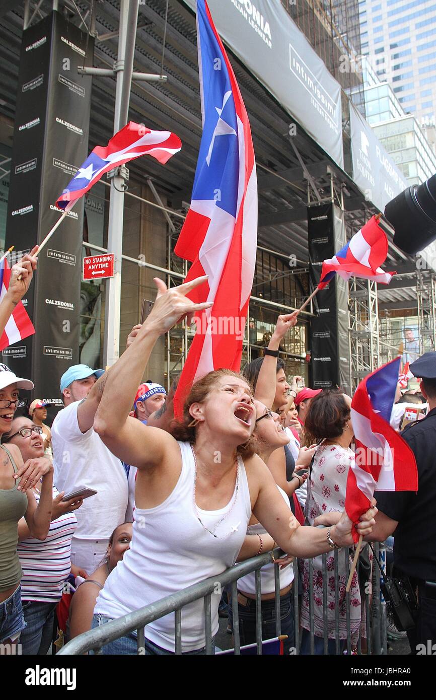 New York, NY, USA. 11th June, 2017. Parade onlookers cheer Oscar Lopez ...