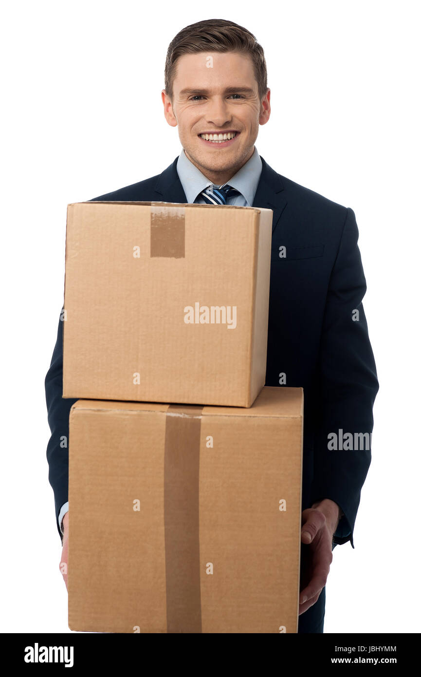 Corporate man posing with cardboard boxes Stock Photo - Alamy