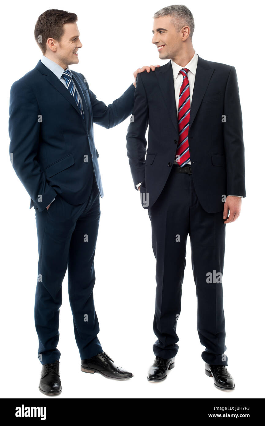 Two men talking standing Cut Out Stock Images & Pictures - Alamy