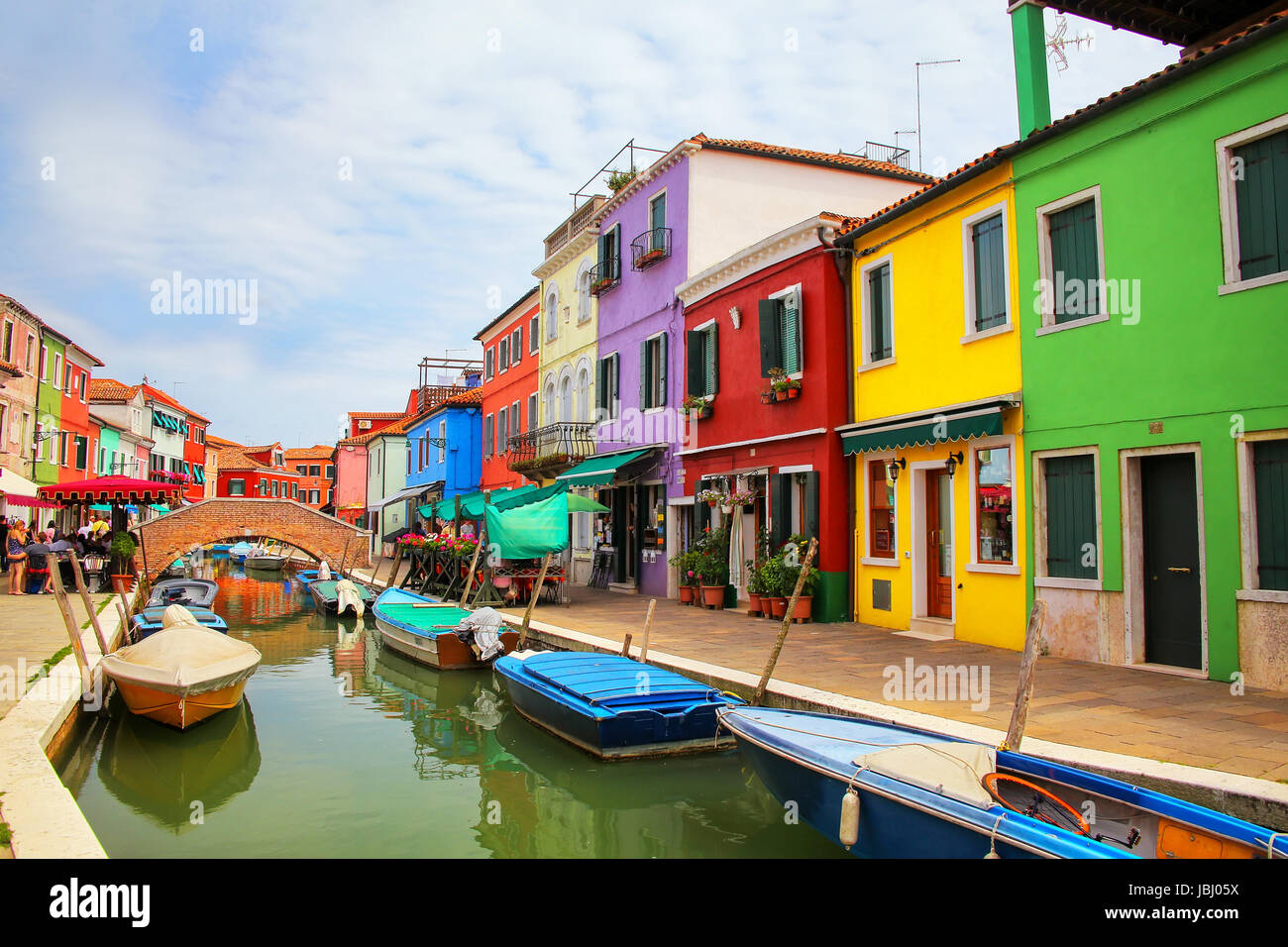 Colorful houses by canal in Burano, Venice, Italy. Burano is an island in the Venetian Lagoon ...
