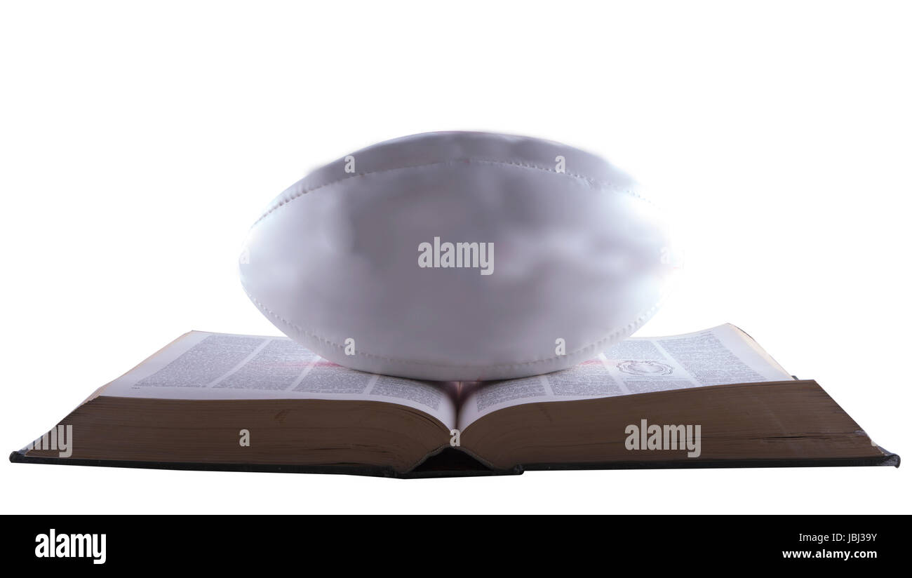 Rugby ball over book, isolated over white background Stock Photo - Alamy