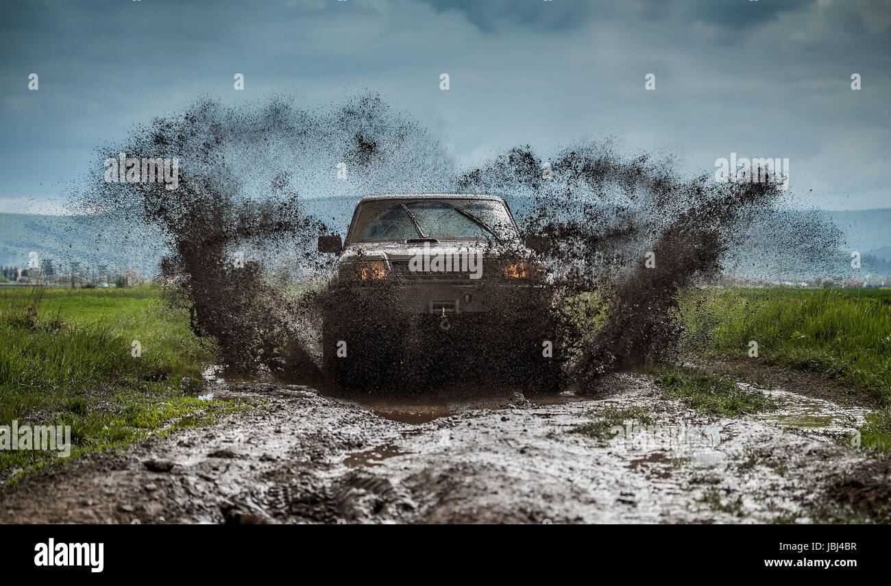Off road car in muddy road Stock Photo - Alamy
