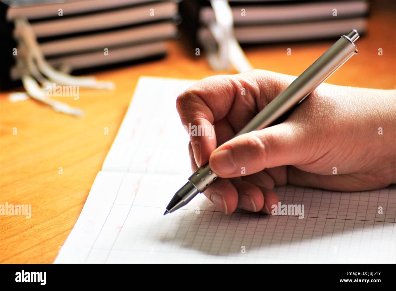 An Image of a Hand with pen - writing Stock Photo - Alamy