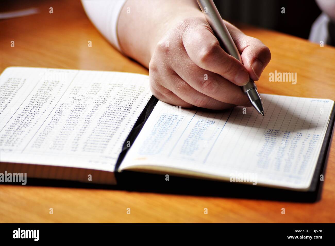 An Image of a Hand with pen - writing Stock Photo - Alamy