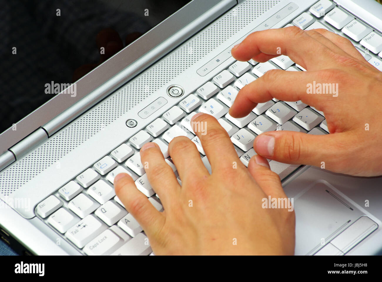 male hands typing on a laptop Stock Photo - Alamy