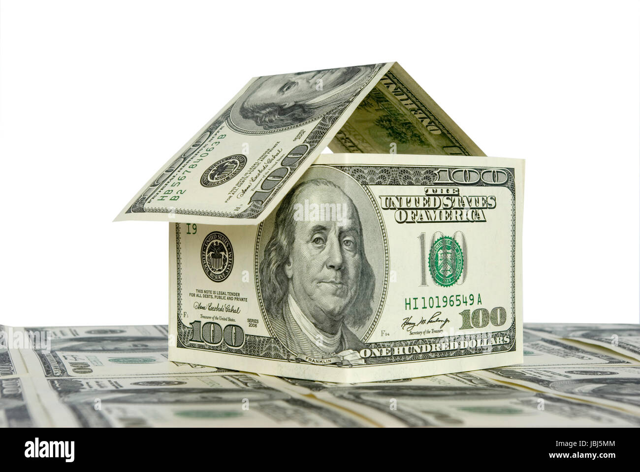 Money house on white background Stock Photo - Alamy