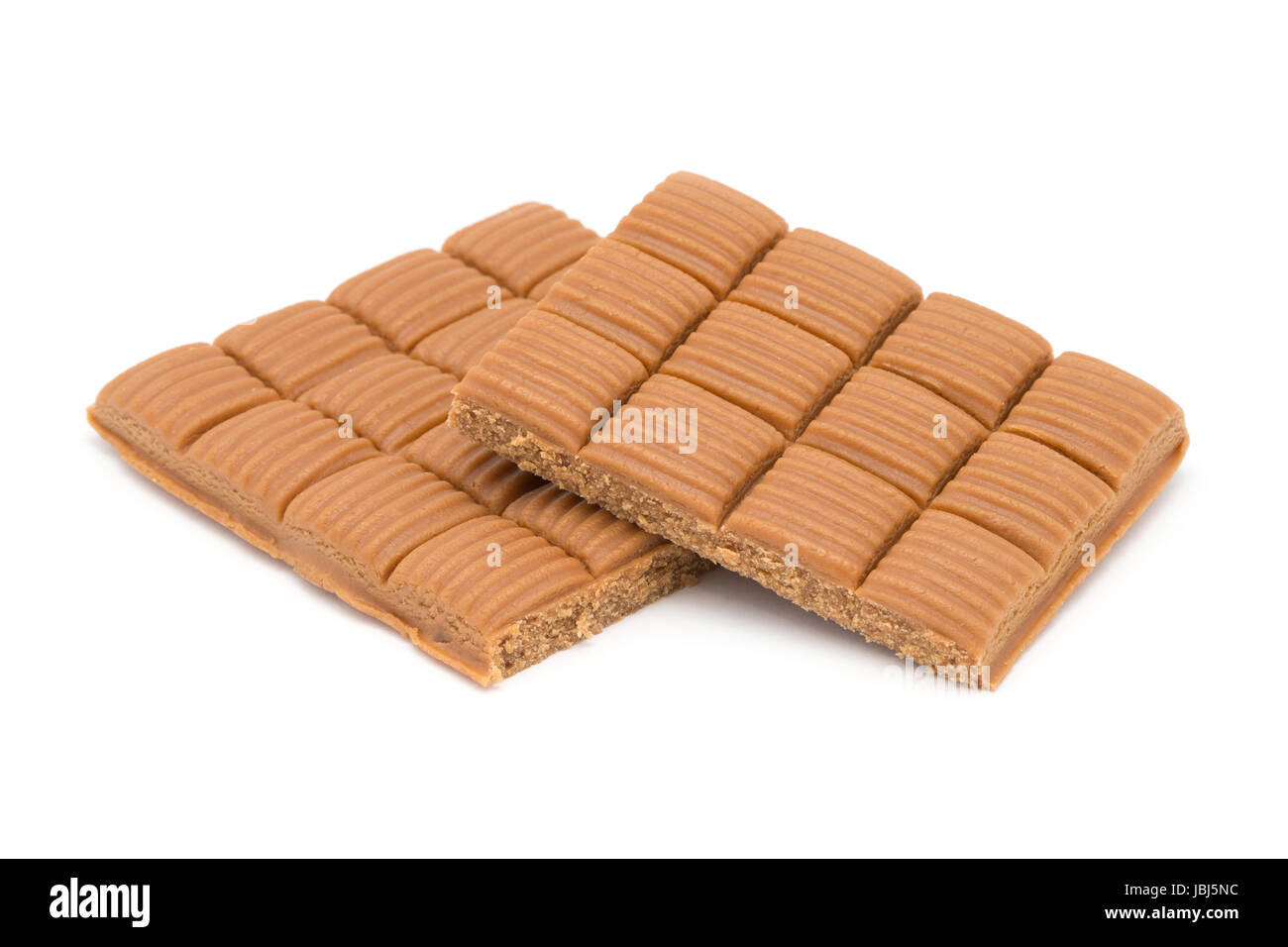 toffee in plate on white background Stock Photo - Alamy
