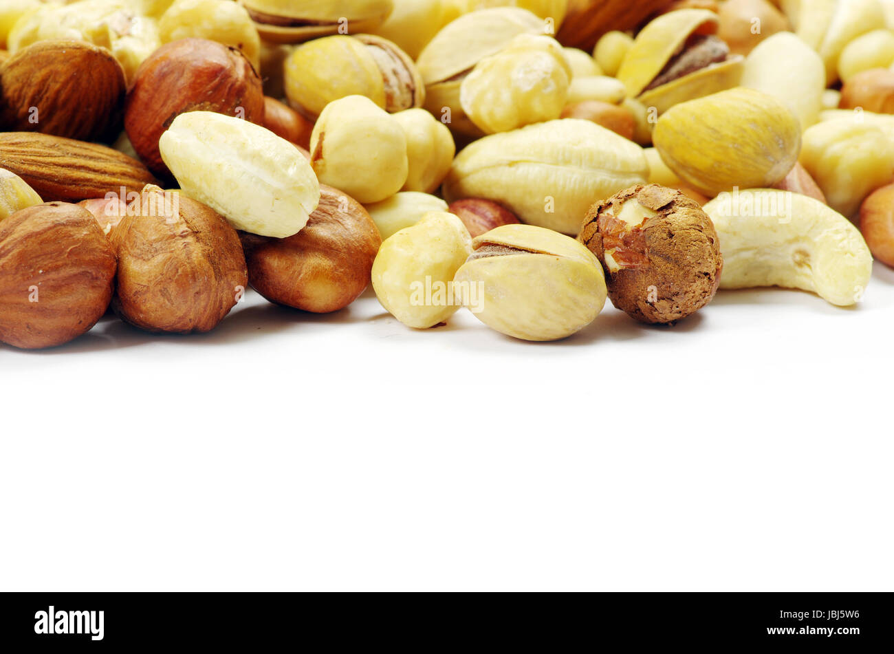 Assorted mixed nuts on white background Stock Photo - Alamy