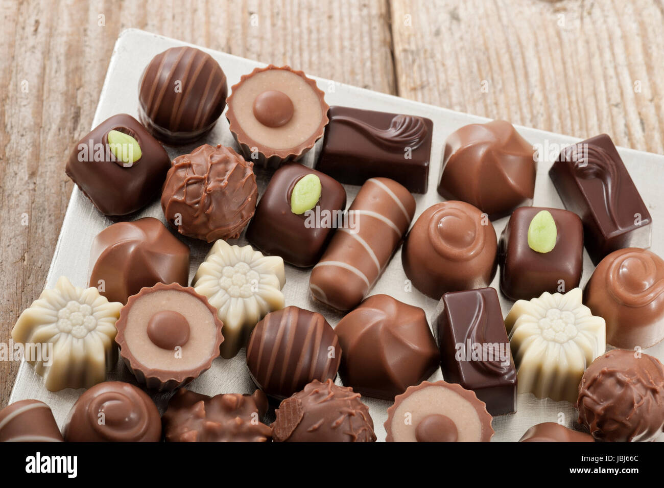 assorted chocolates confectionery on silver tray Stock Photo - Alamy
