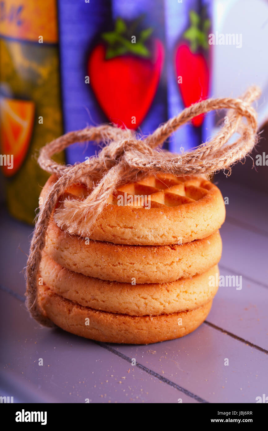 Four biscuits in a pack bound with a rope Stock Photo - Alamy