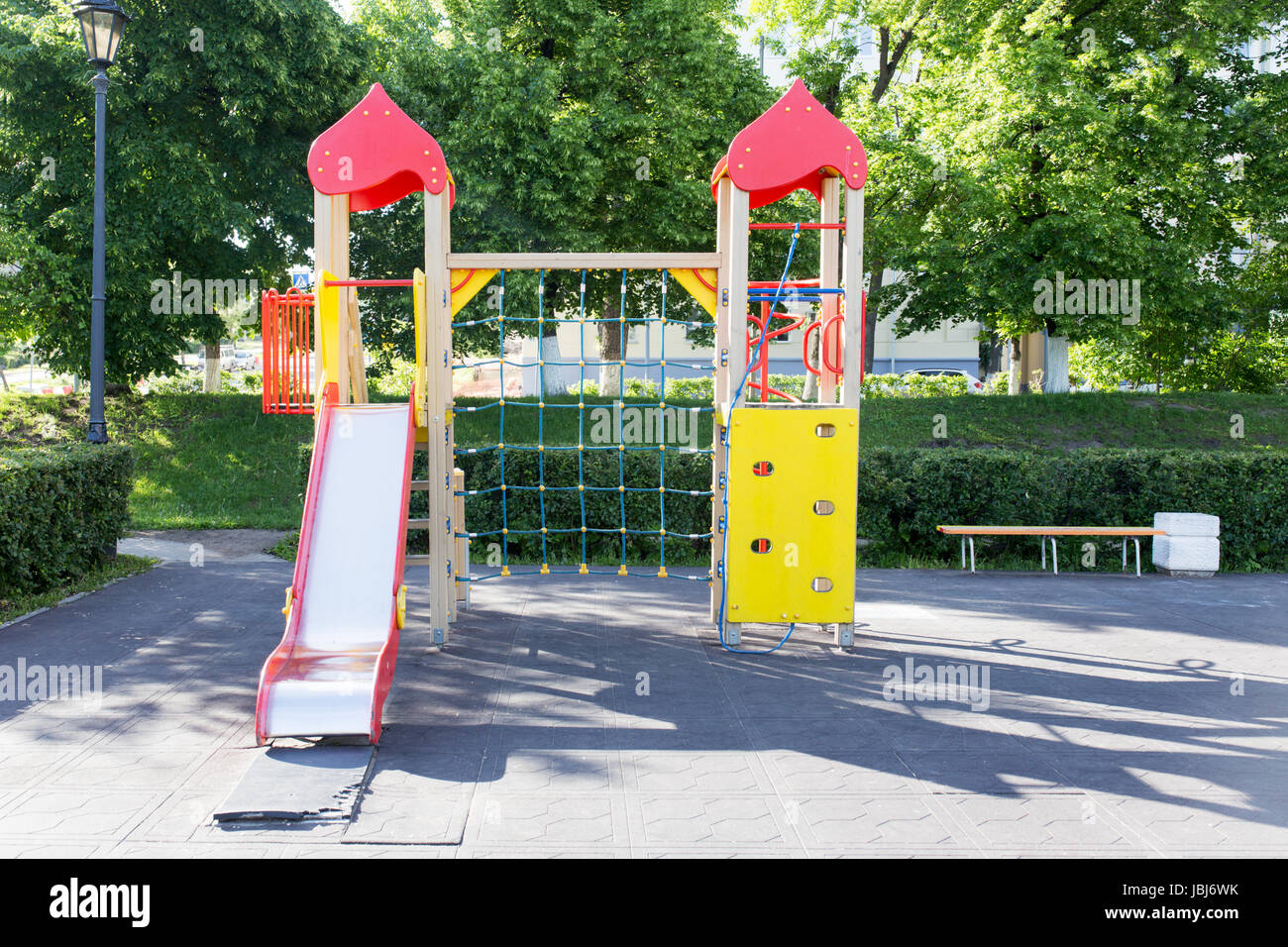 Modern Playground Equipment. Modern Colorful kids playground on yard in ...