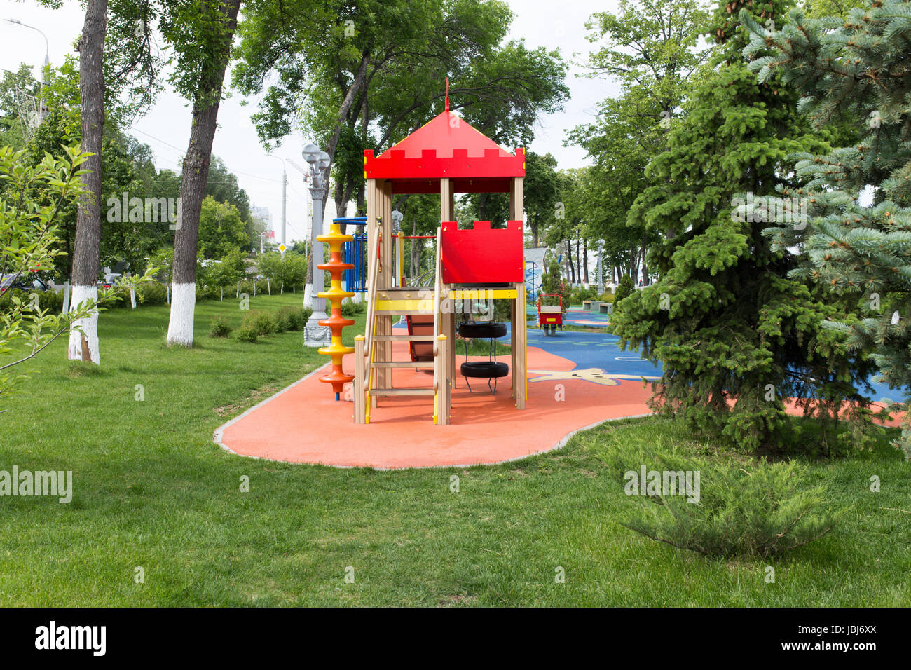 Modern Playground Equipment. Modern Colorful kids playground on yard in ...