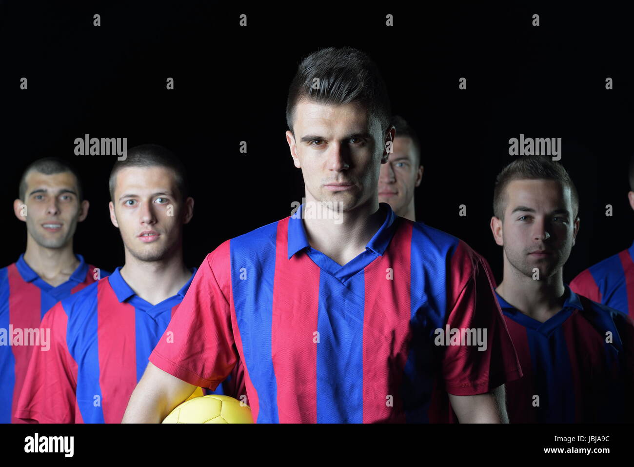 soccer players team group isolated on black background Stock Photo - Alamy
