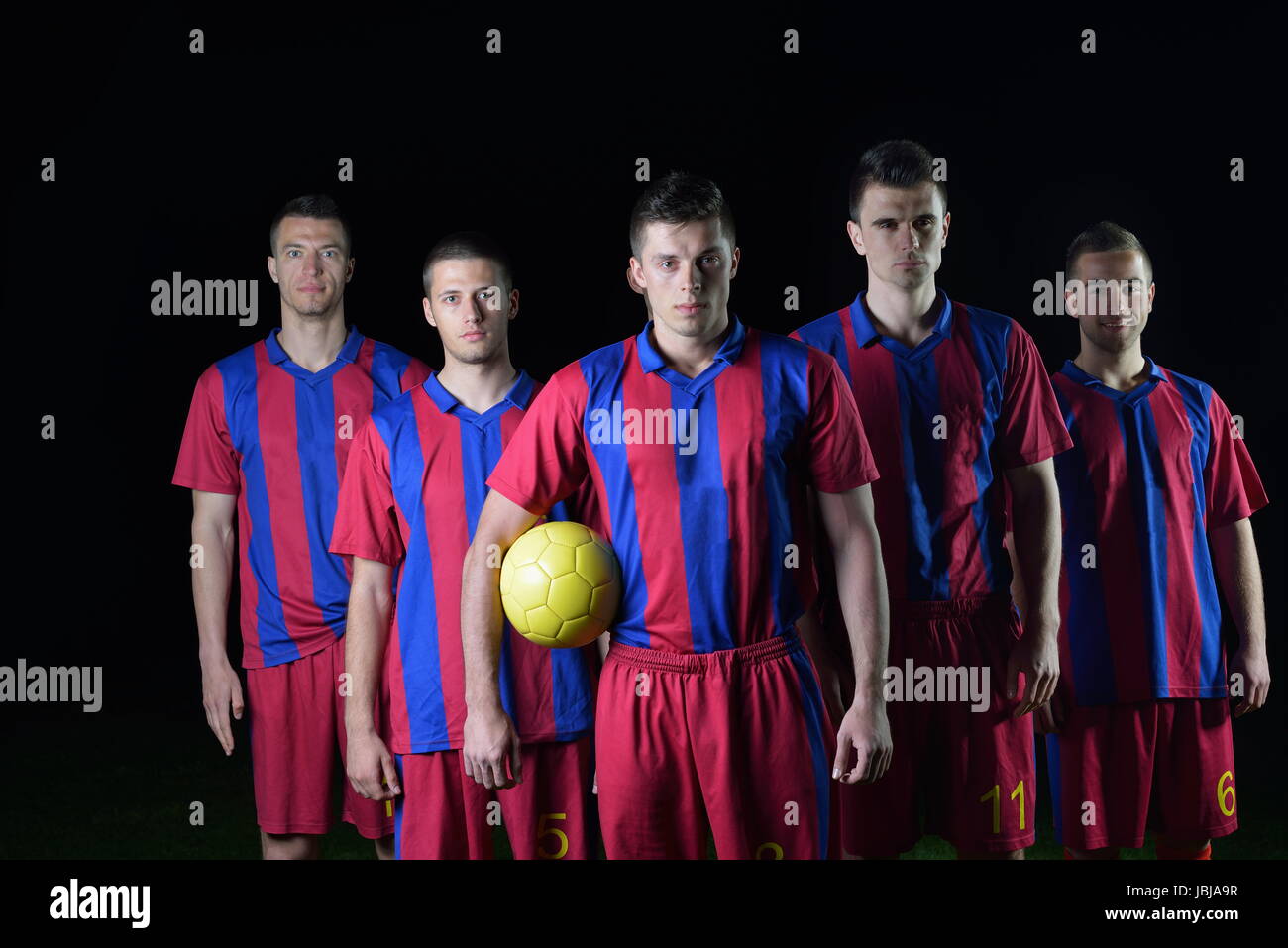 soccer players team group isolated on black background Stock Photo - Alamy