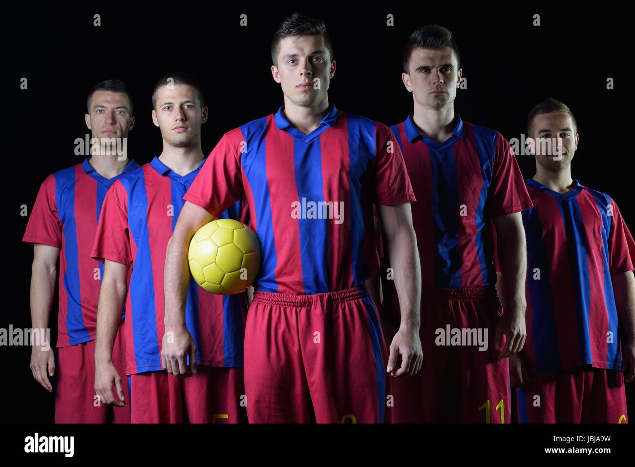 soccer players team group isolated on black background Stock Photo - Alamy