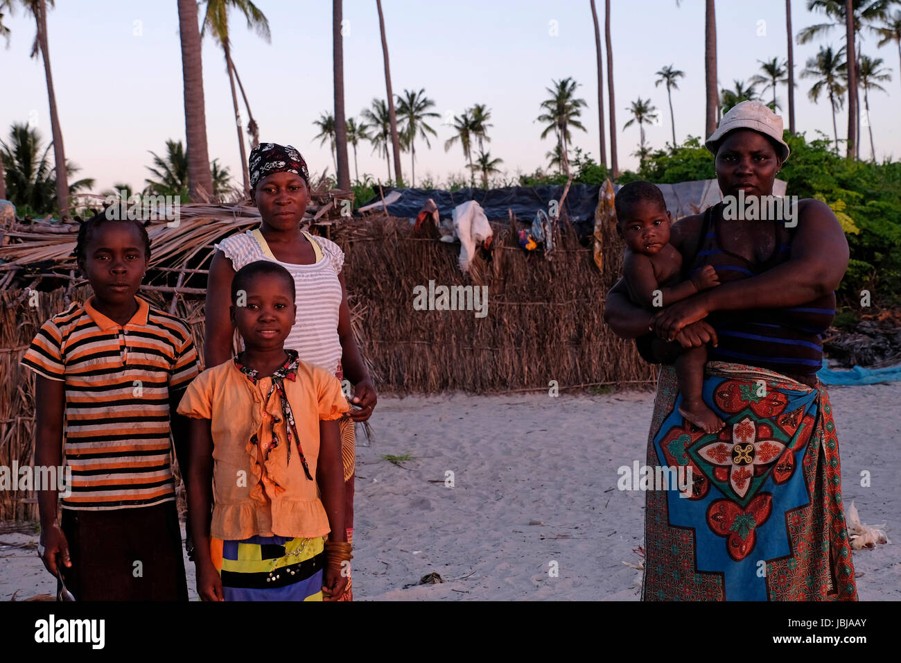 Local villagers at the seashore of the small island of Matemo in the ...