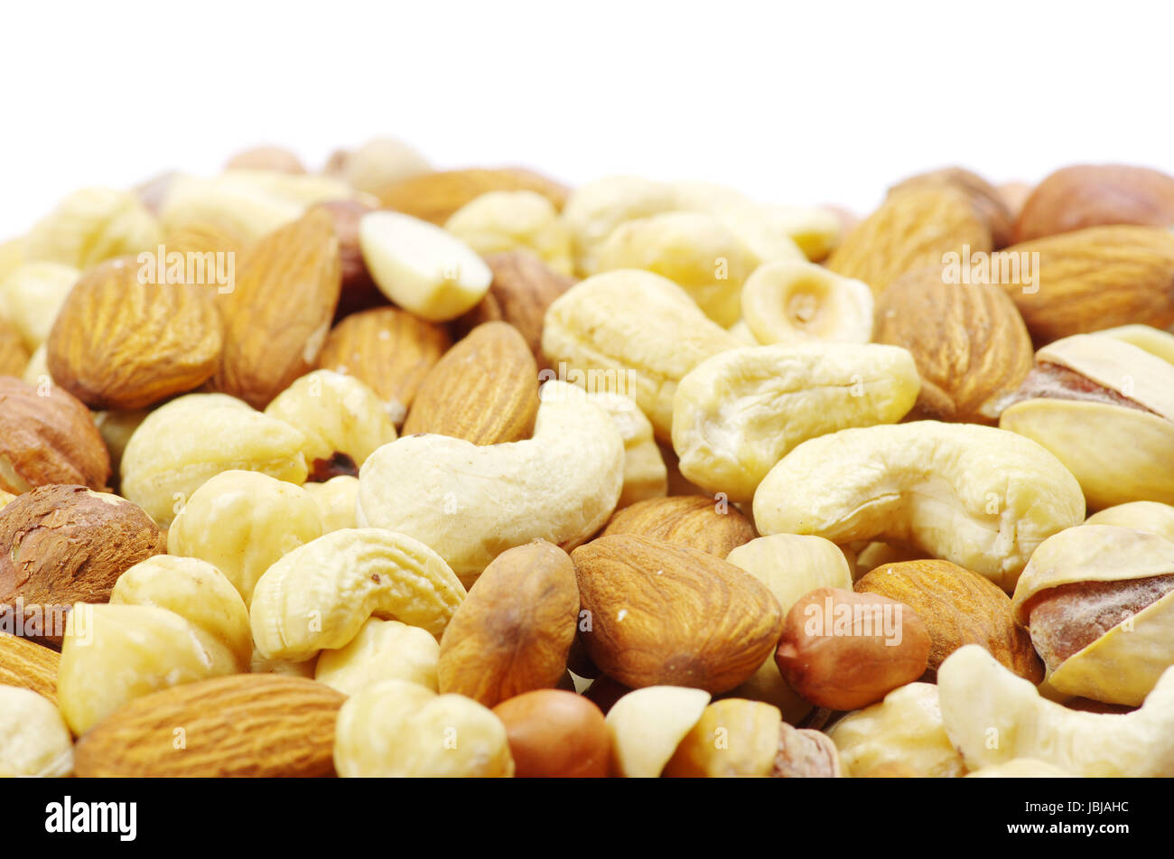 Assorted mixed nuts on white background Stock Photo - Alamy