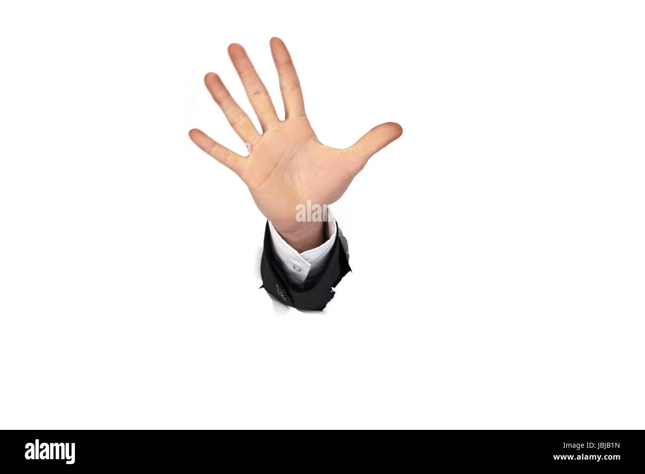 business man hand in the paper whole white Stock Photo - Alamy