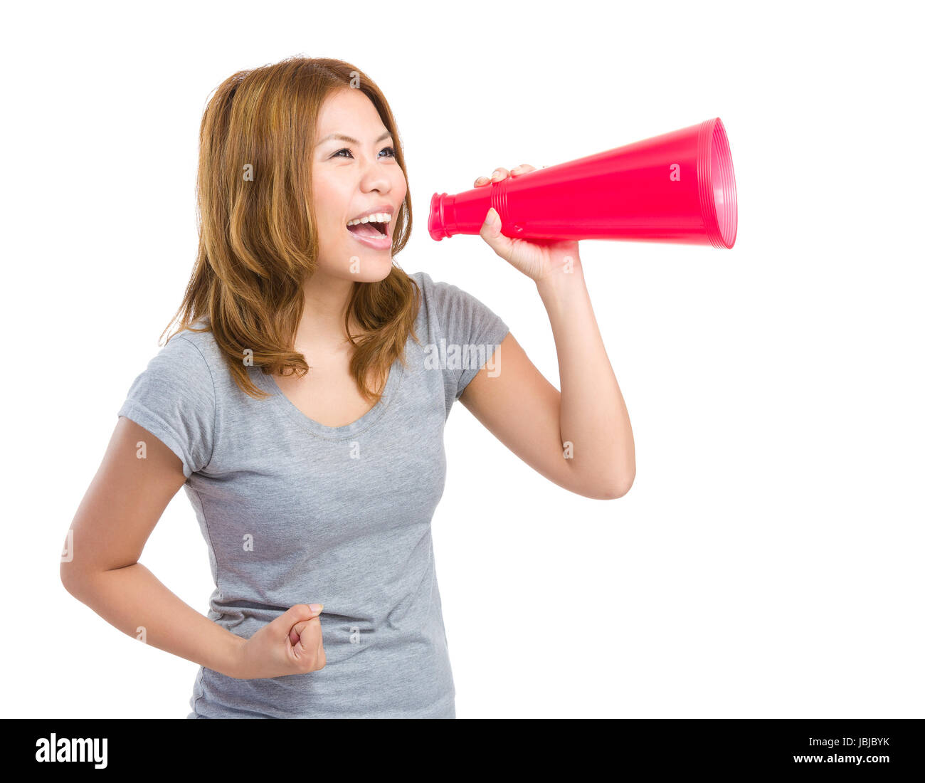 Excited woman yelling with megaphone Stock Photo - Alamy