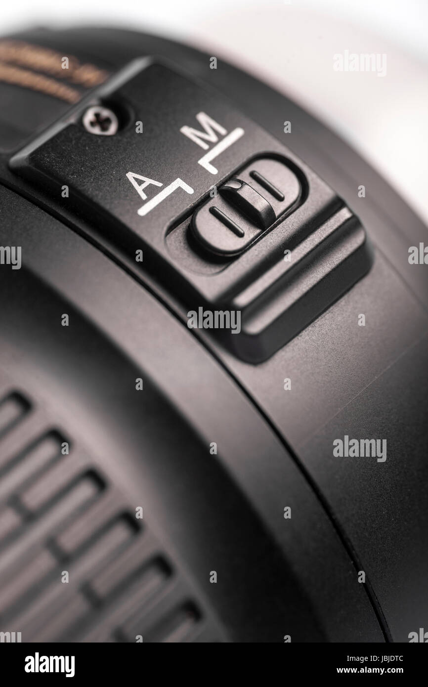 Detail of the auto focus switch on a photo lenses Stock Photo - Alamy