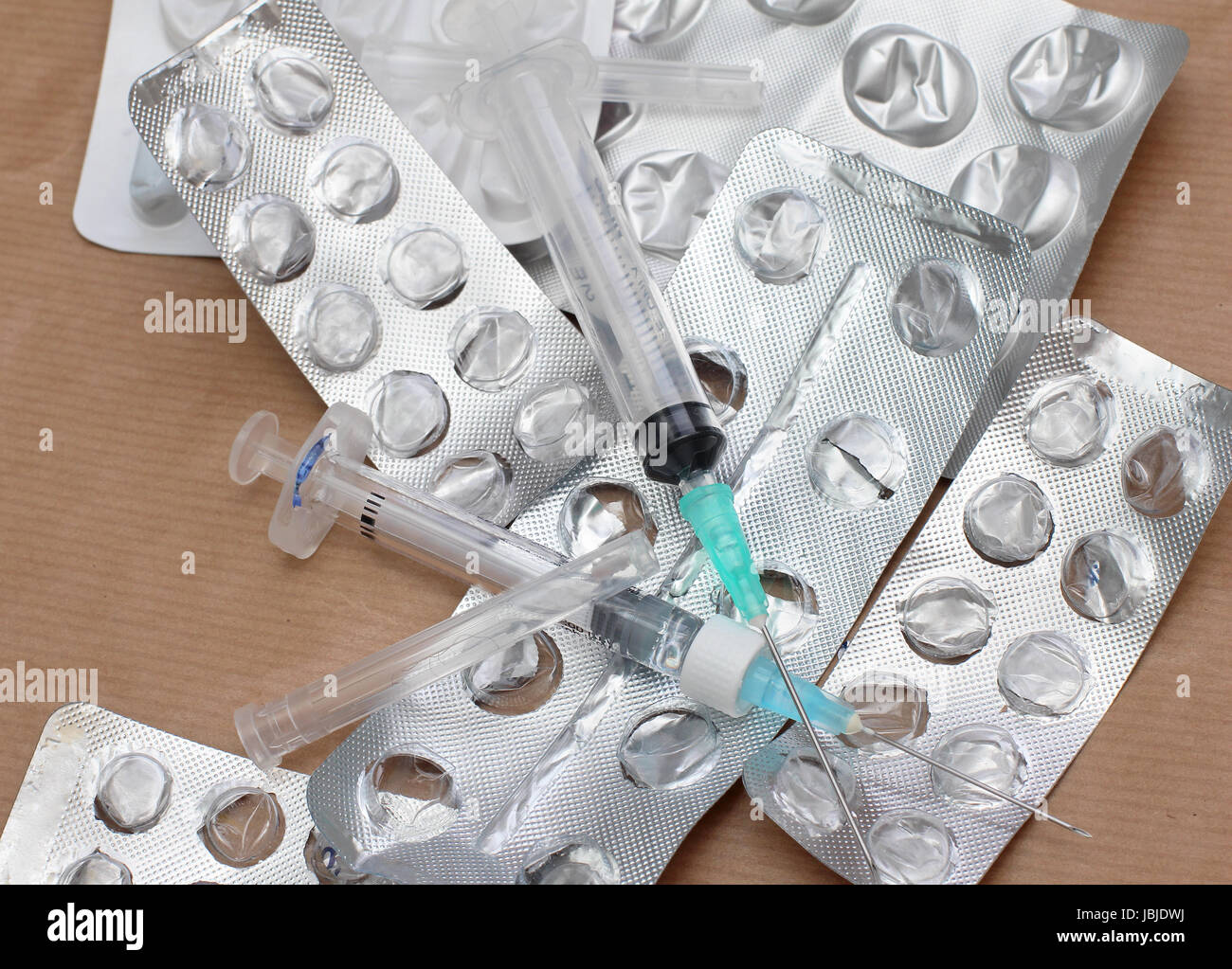 Pile of used mpty blisters and syringes Stock Photo - Alamy